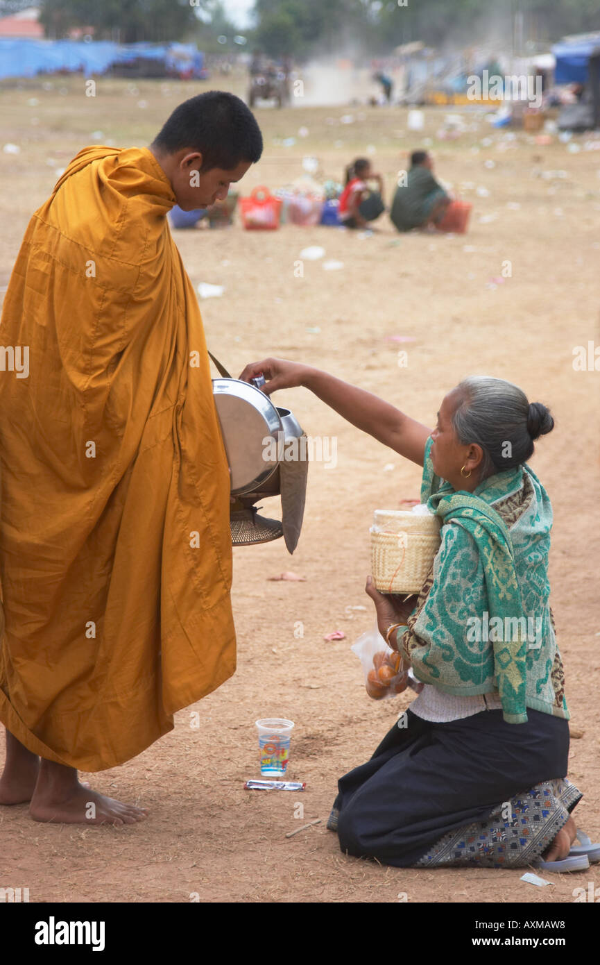 Elderly Woman Giving Monk Morning Alms, Wat Phu Champasak Stock Photo ...