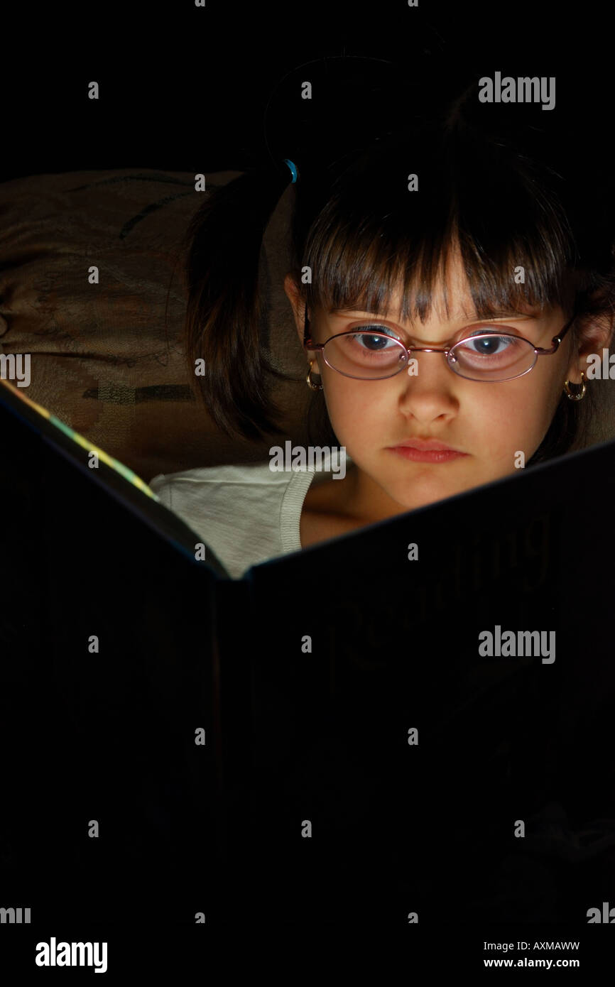 Girl Reading Magic Book Stock Photo - Alamy