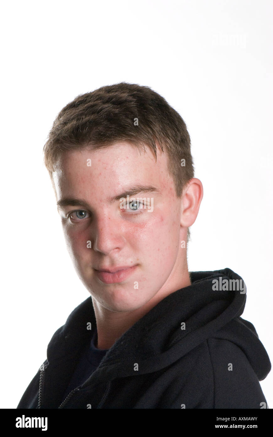 Teenage boy looking serious Stock Photo - Alamy