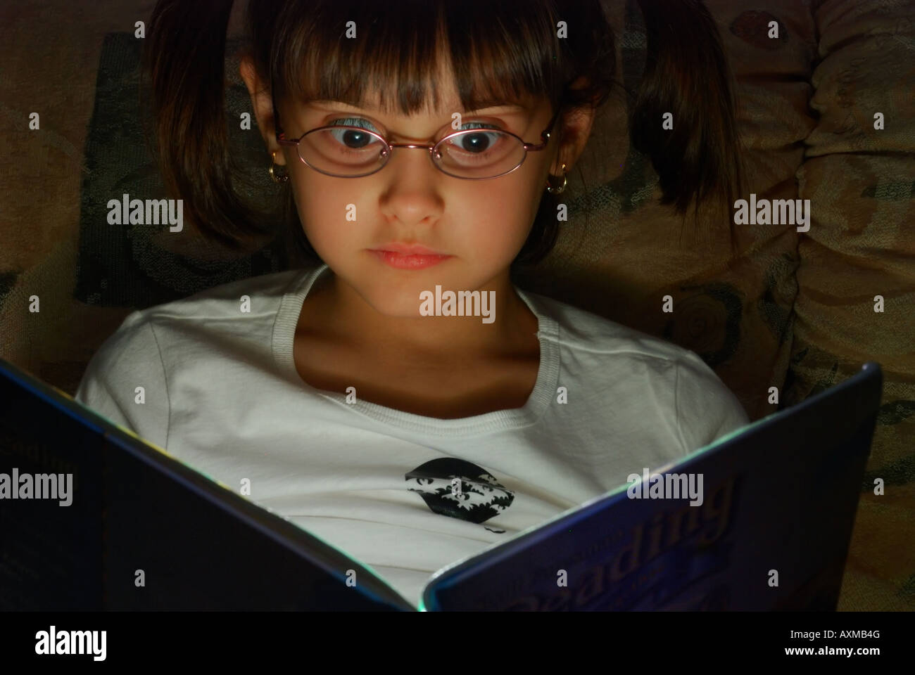 Girl Reading Magic Book Stock Photo - Alamy