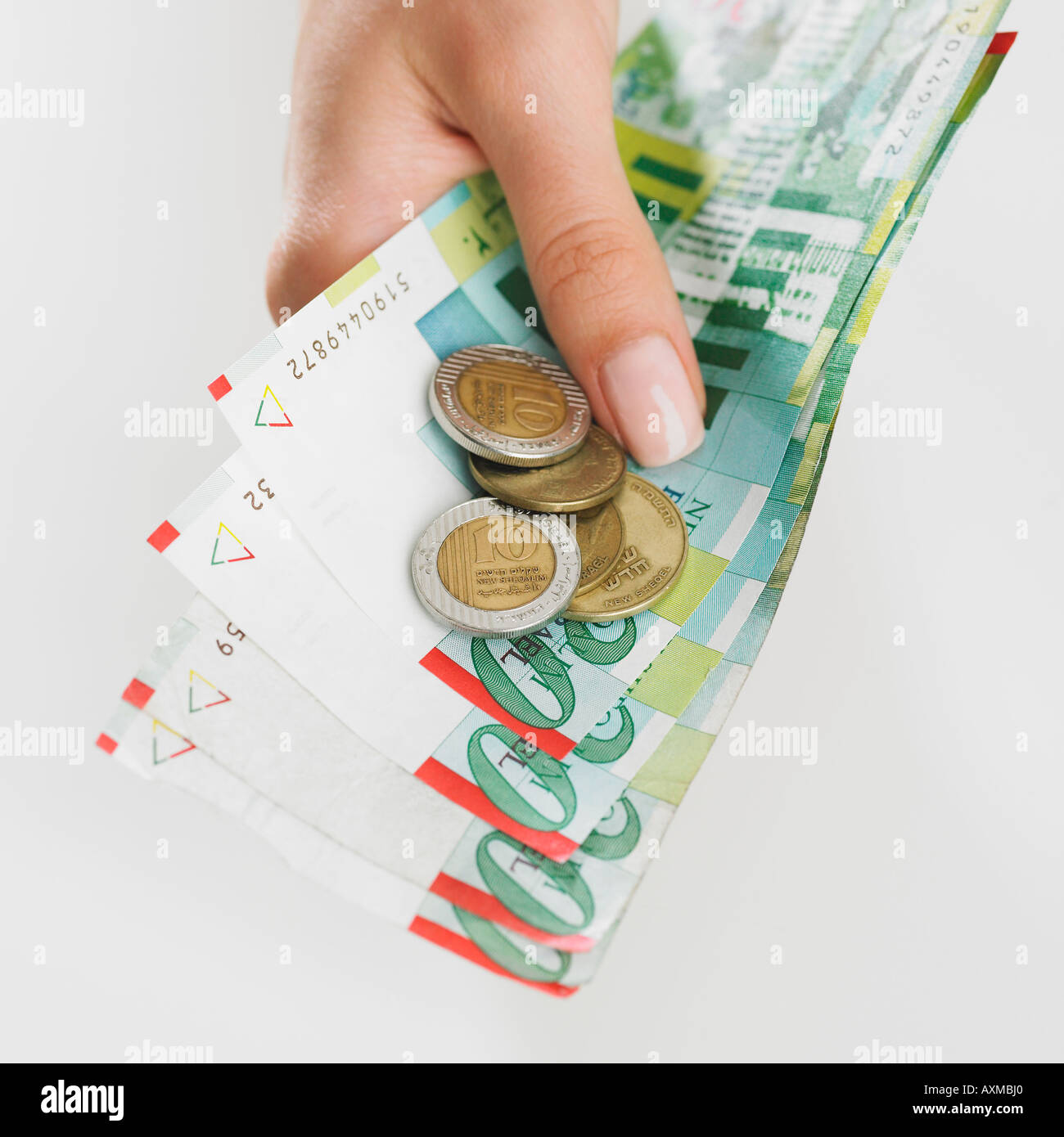 Close up studio shot of woman s hand holding money Stock Photo - Alamy