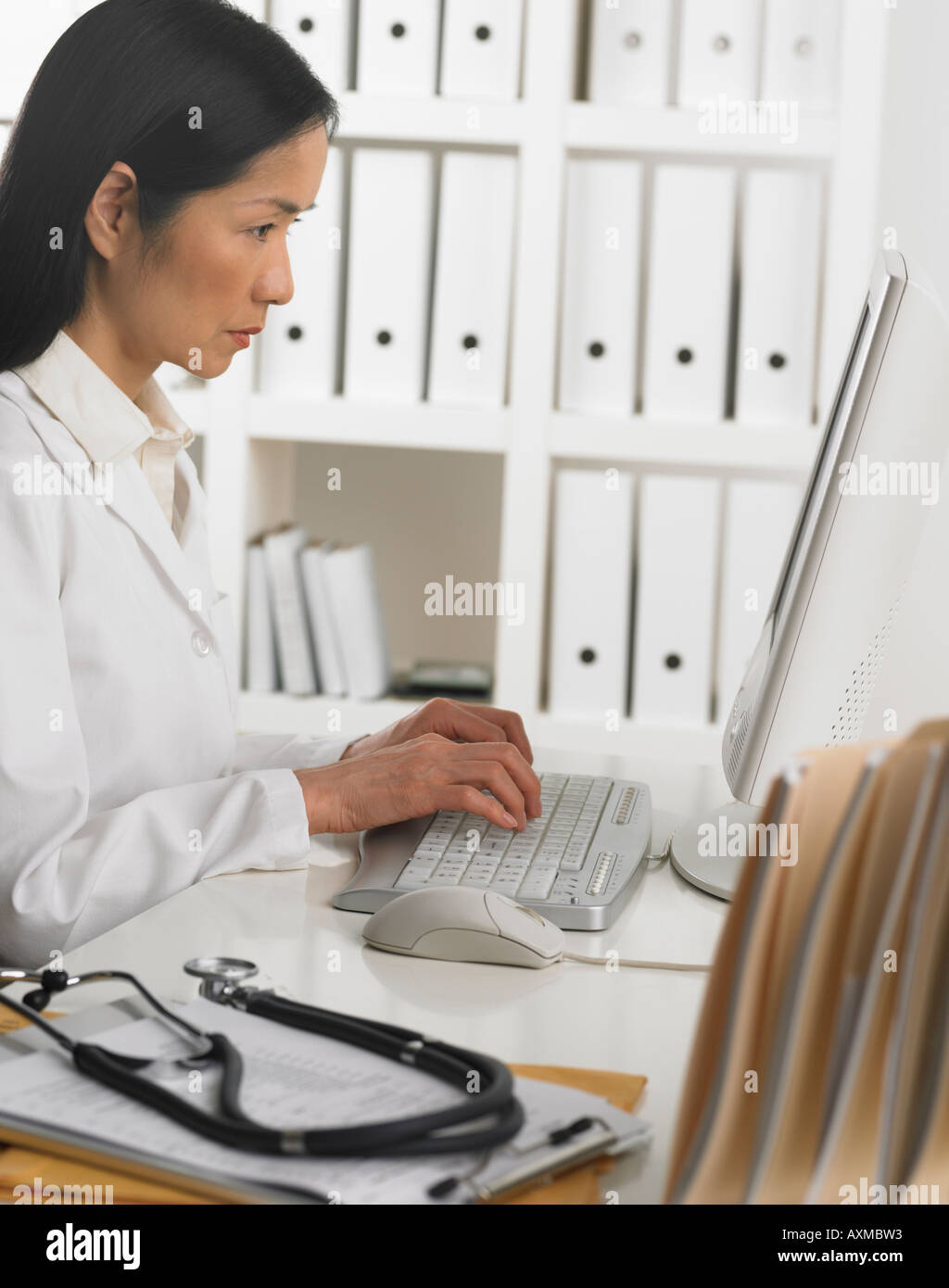 Female doctor using computer Stock Photo - Alamy