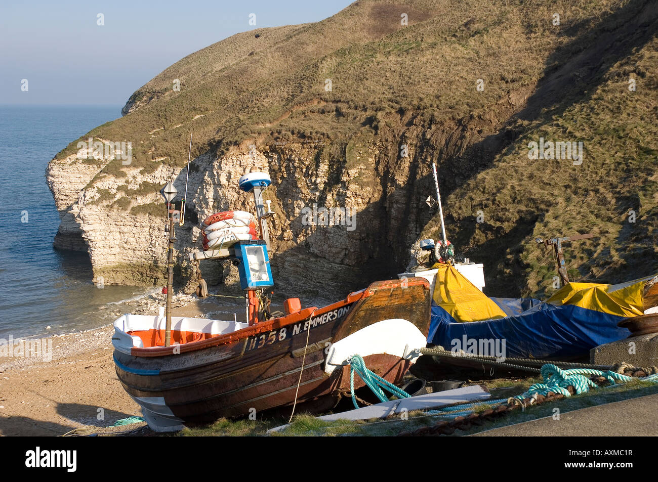 Small local fishing boat on the beach in winter North Landing ...