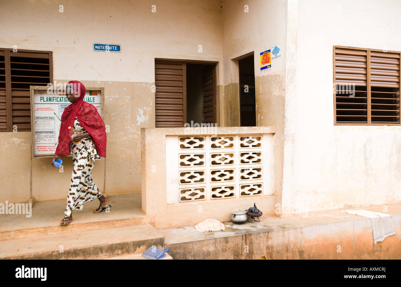 A woman walks out of the Adja Ouere community health center in the ...