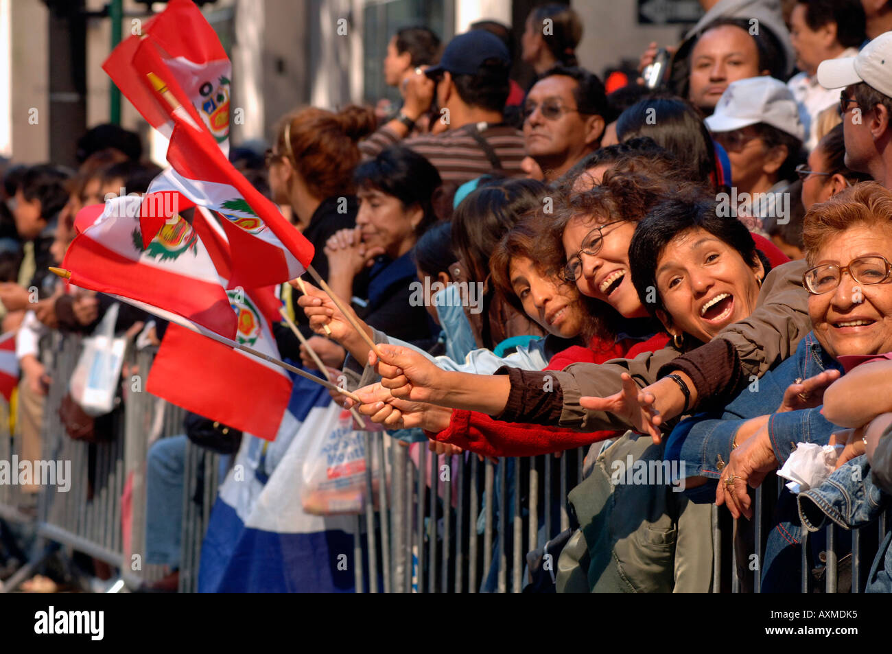 NYC annual Hispanic Day Parade Spectators wave the flag of Peru Stock ...