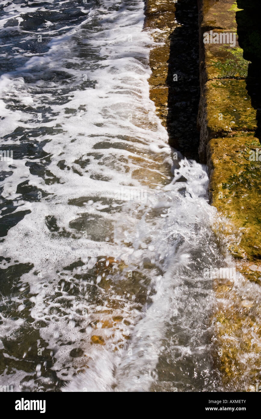 waves wash over sandstone steps Stock Photo - Alamy