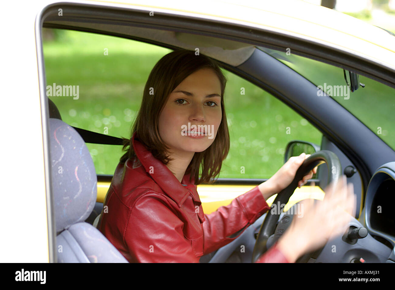 Young woman driving a car Stock Photo - Alamy