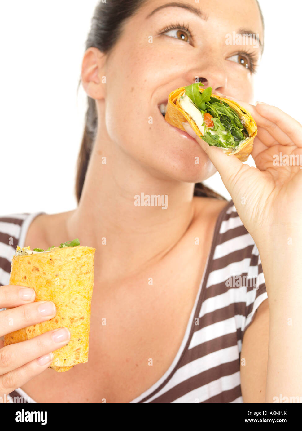 Young Woman Eating Chicken Wrap Stock Photo - Alamy