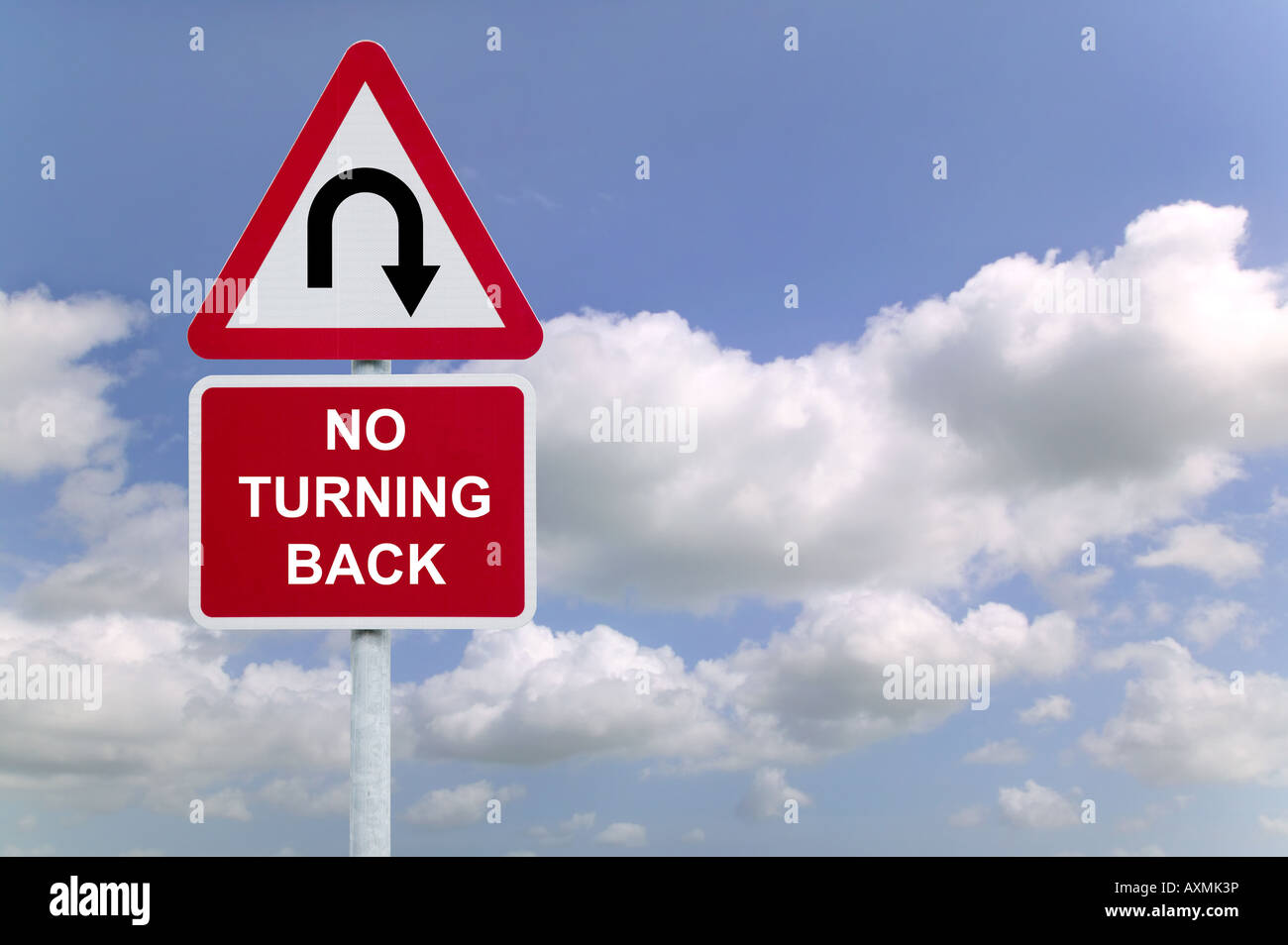 Signpost with No Turning Back against a blue cloudy sky business ...