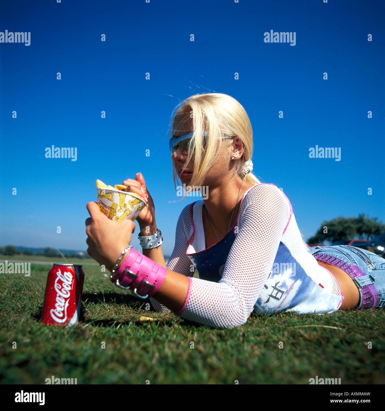 Young Woman Eating Stock Photo - Alamy