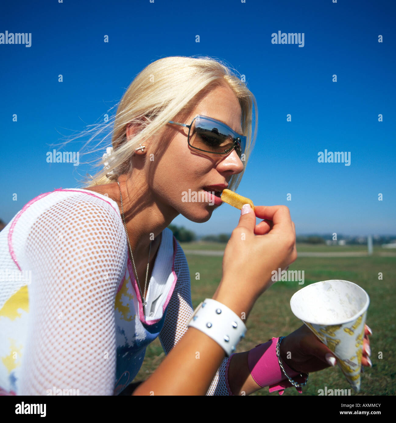 Young Woman Eating Stock Photo - Alamy