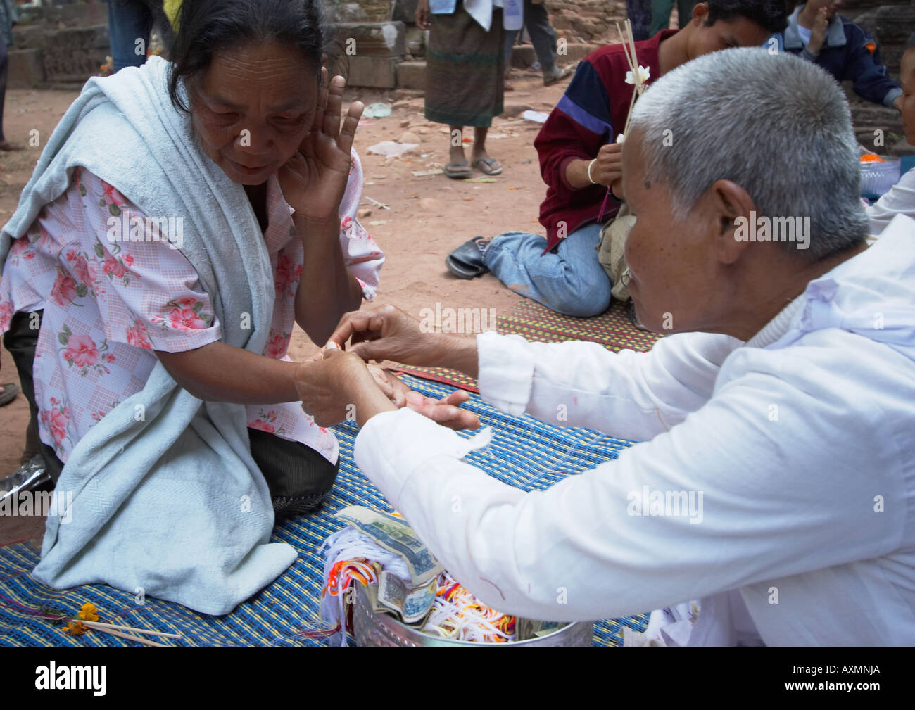 Receiving traditional buddhist blessing wat hi-res stock photography ...