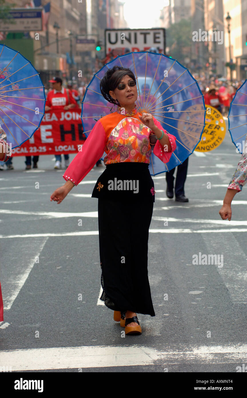 Dancer with parasol in the NYC Labor Day Parade Stock Photo - Alamy