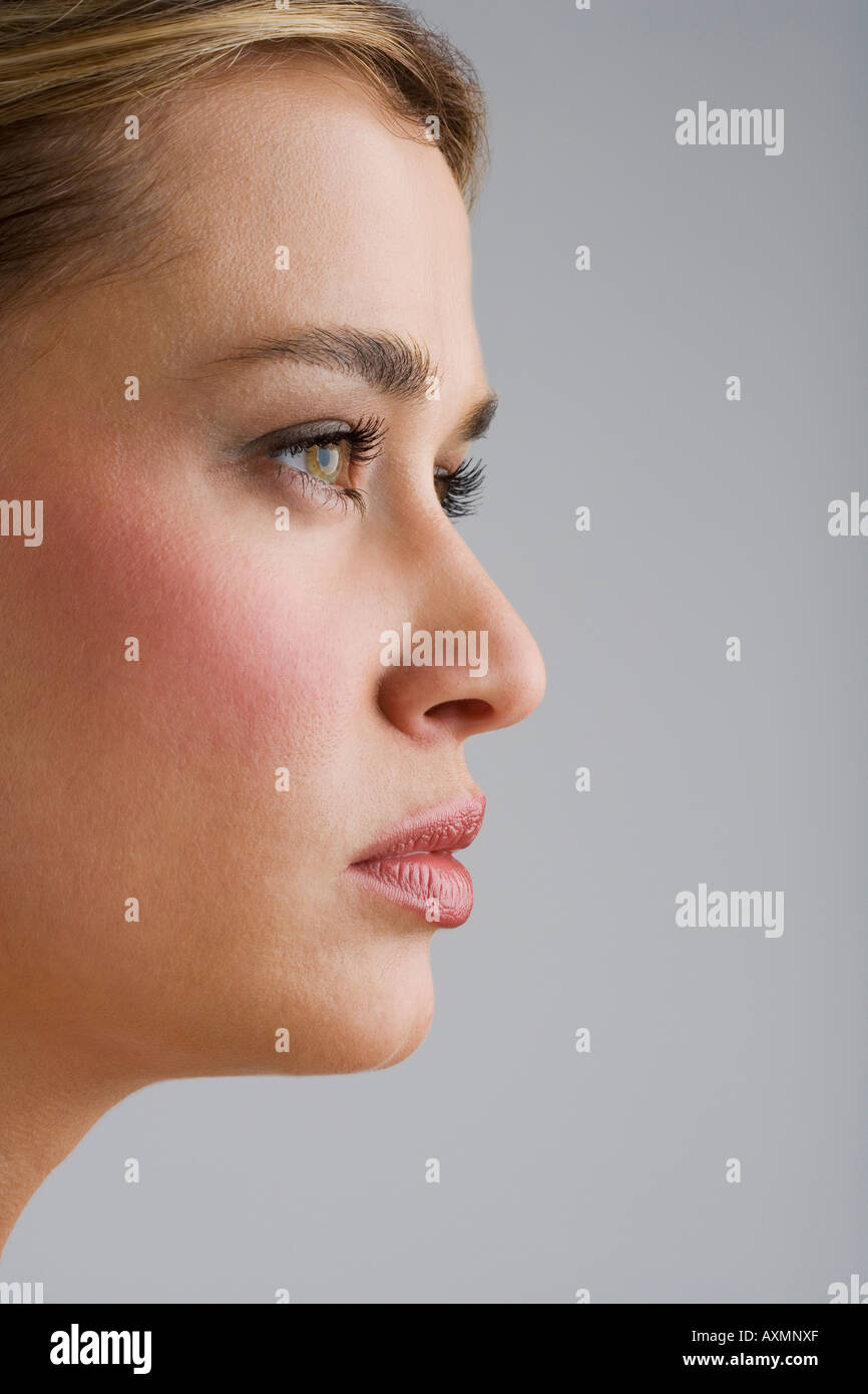 Portrait of young woman in profile Stock Photo - Alamy