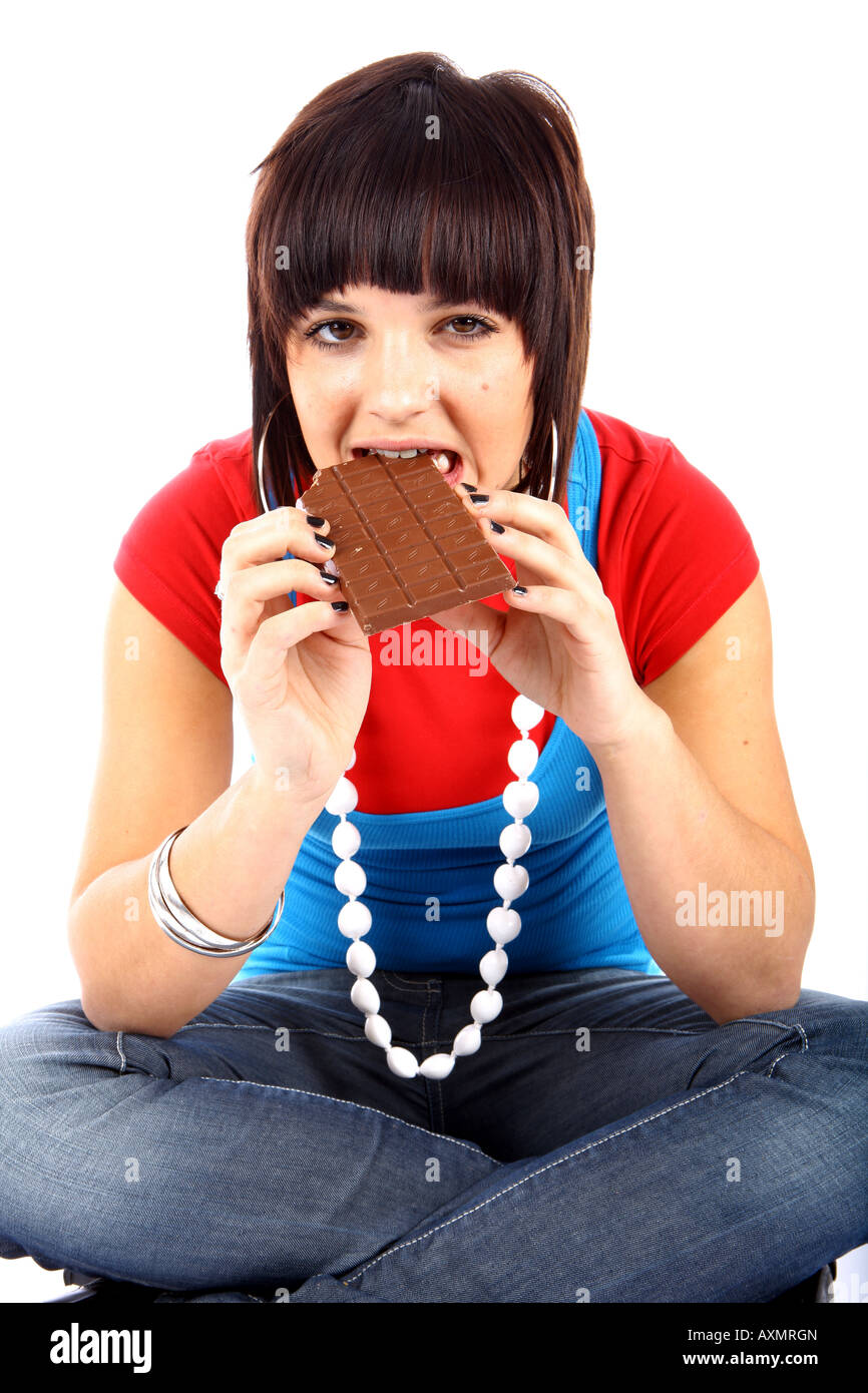 Teenage Girl Eating Chocolate Bar Model Released Stock Photo - Alamy