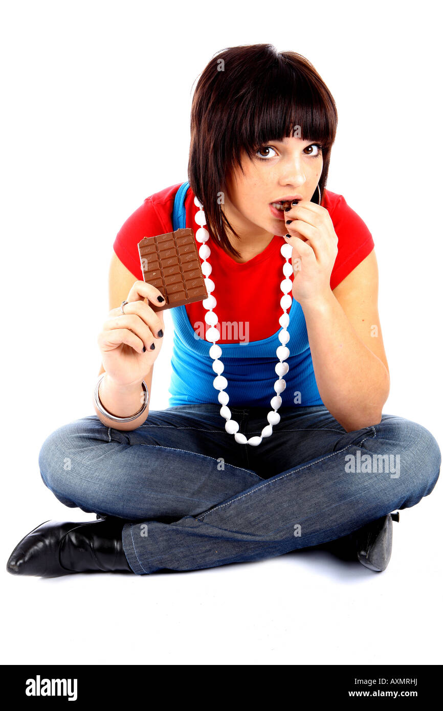 Attractive woman eating chocolate Cut Out Stock Images & Pictures - Alamy