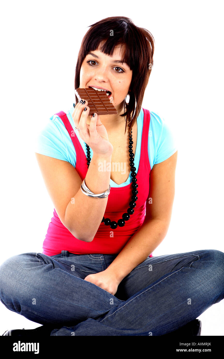 Teenage Girl Eating Chocolate Bar Model Released Stock Photo - Alamy