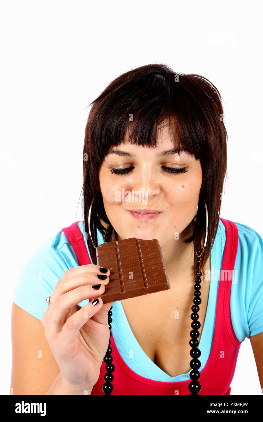 Teenage Girl Eating Chocolate Bar Model Released Stock Photo - Alamy