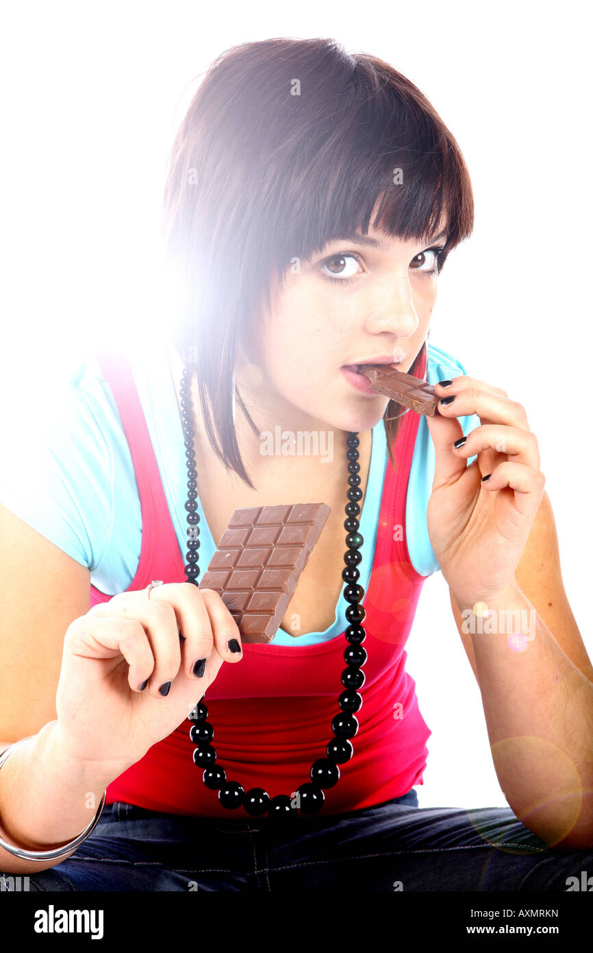 Teenage Girl Eating Chocolate Bar Model Released Stock Photo - Alamy