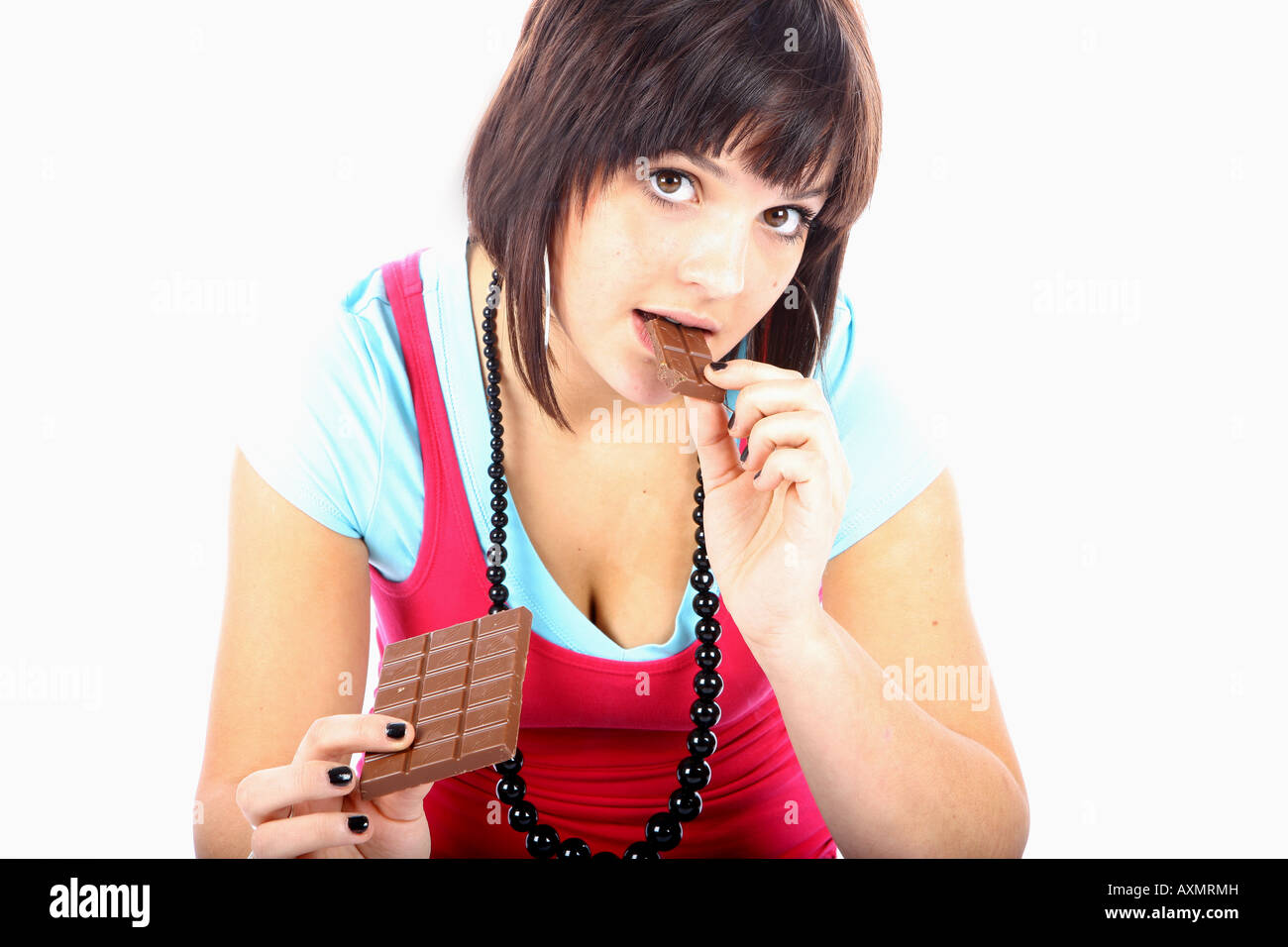 Teenage Girl Eating Chocolate Bar Model Released Stock Photo - Alamy
