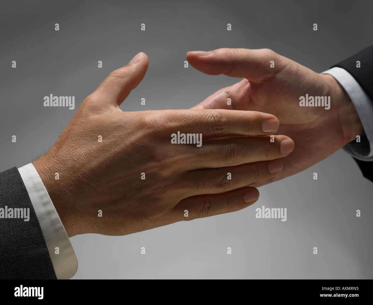 Two men about to shake hands Stock Photo - Alamy