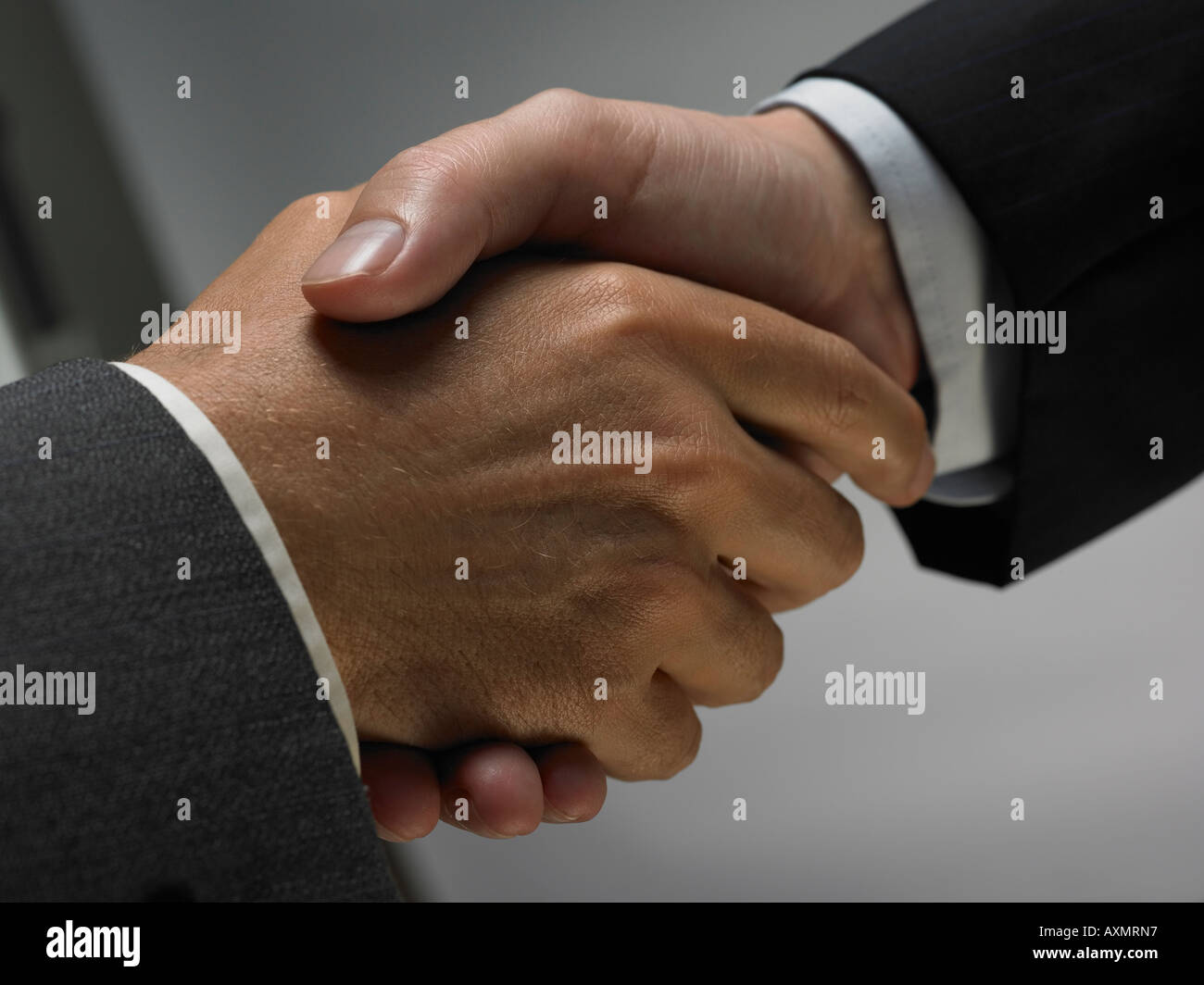 Two men shaking hands Stock Photo - Alamy