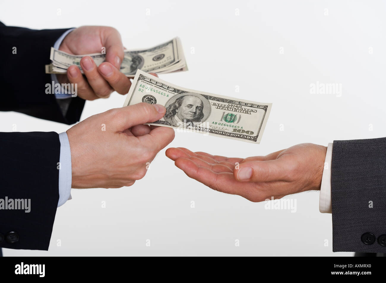 Businessman giving money to a man Stock Photo - Alamy