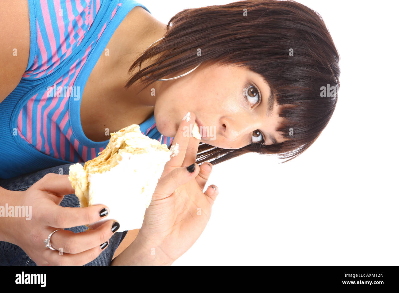 Teenage Girl Eating Cream Cake Model Released Stock Photo - Alamy