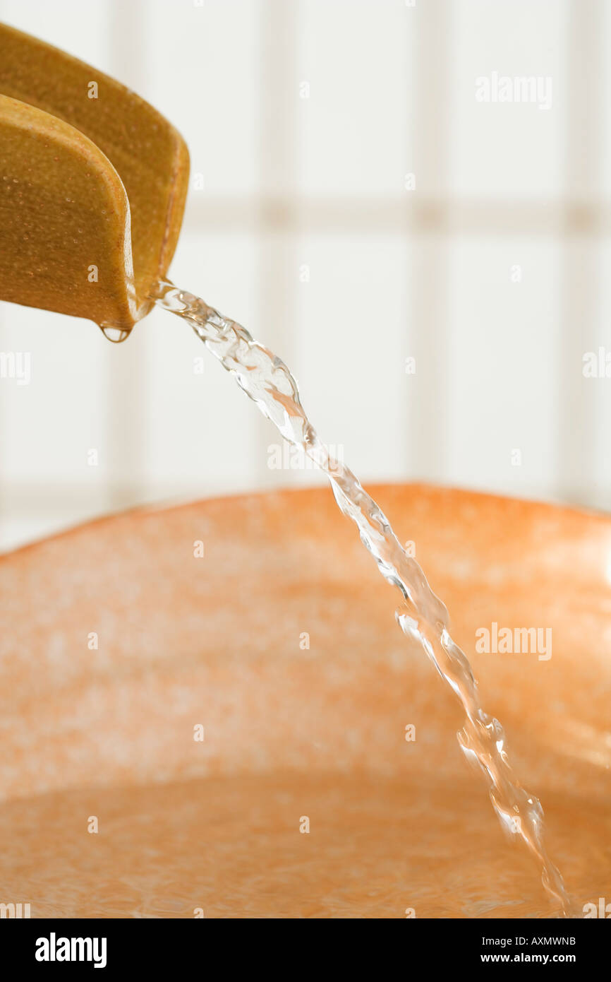 Water pouring out of plant stalk Stock Photo - Alamy