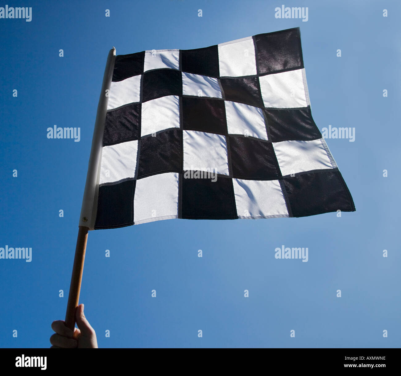 Checkered flag with blue sky Stock Photo - Alamy