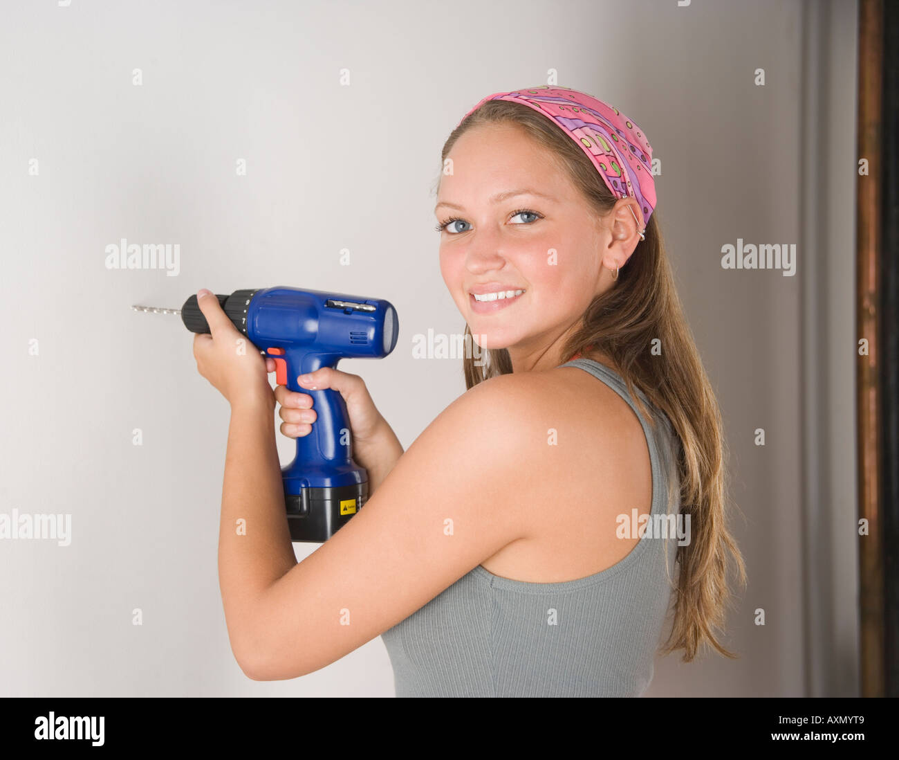 Female wall drill hi-res stock photography and images - Alamy