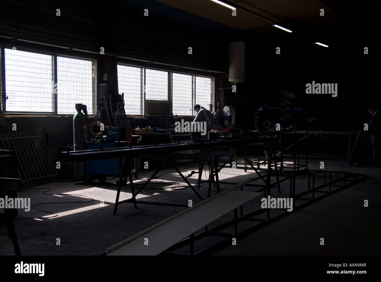 Stock photo of the inside of a dramatically lit light industrial ...