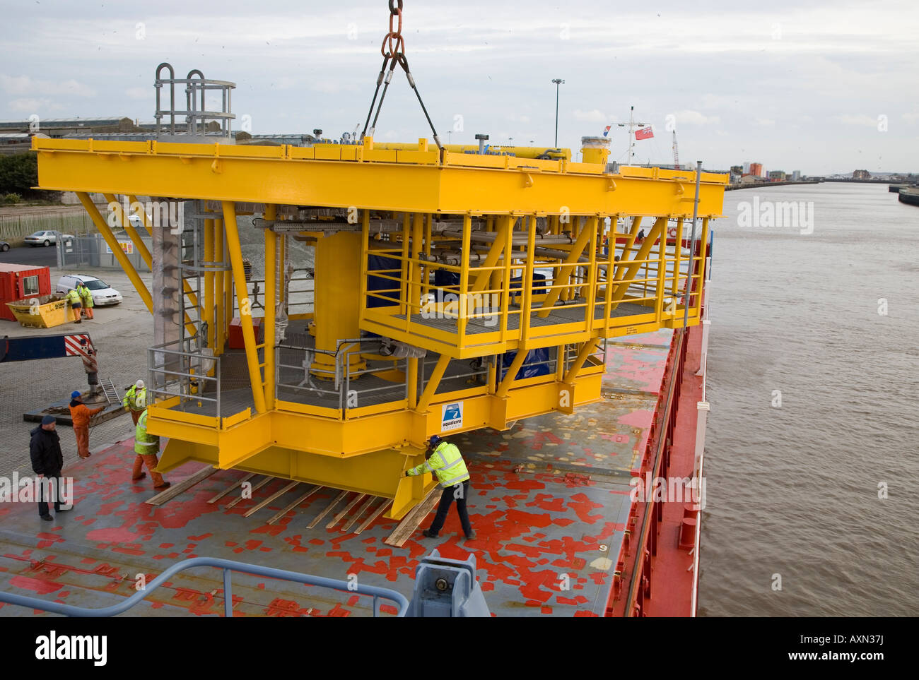 Rig platform being loaded onto container ship at Yarmouth Stock Photo ...