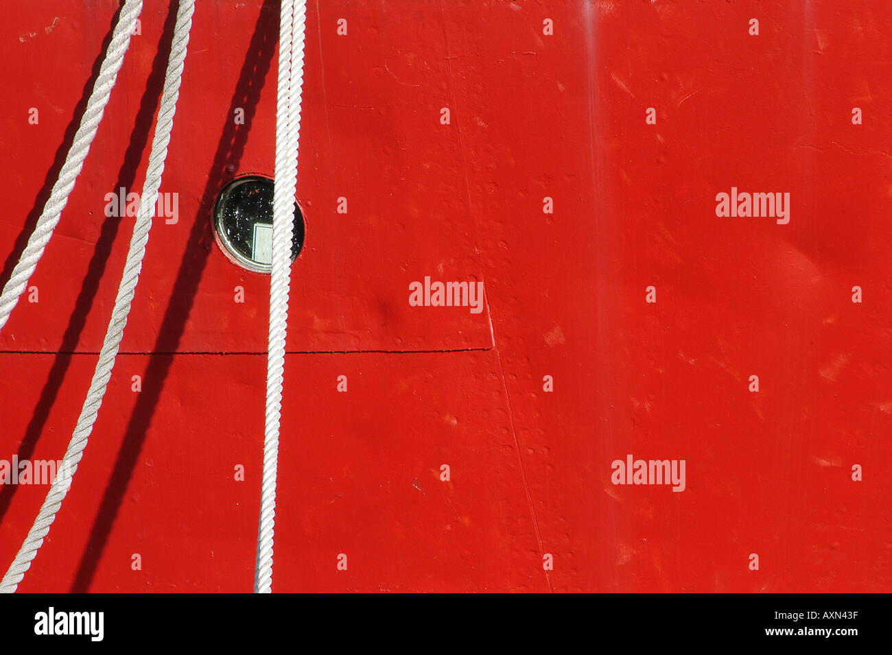 Hull of a red ship with rigging Stock Photo - Alamy