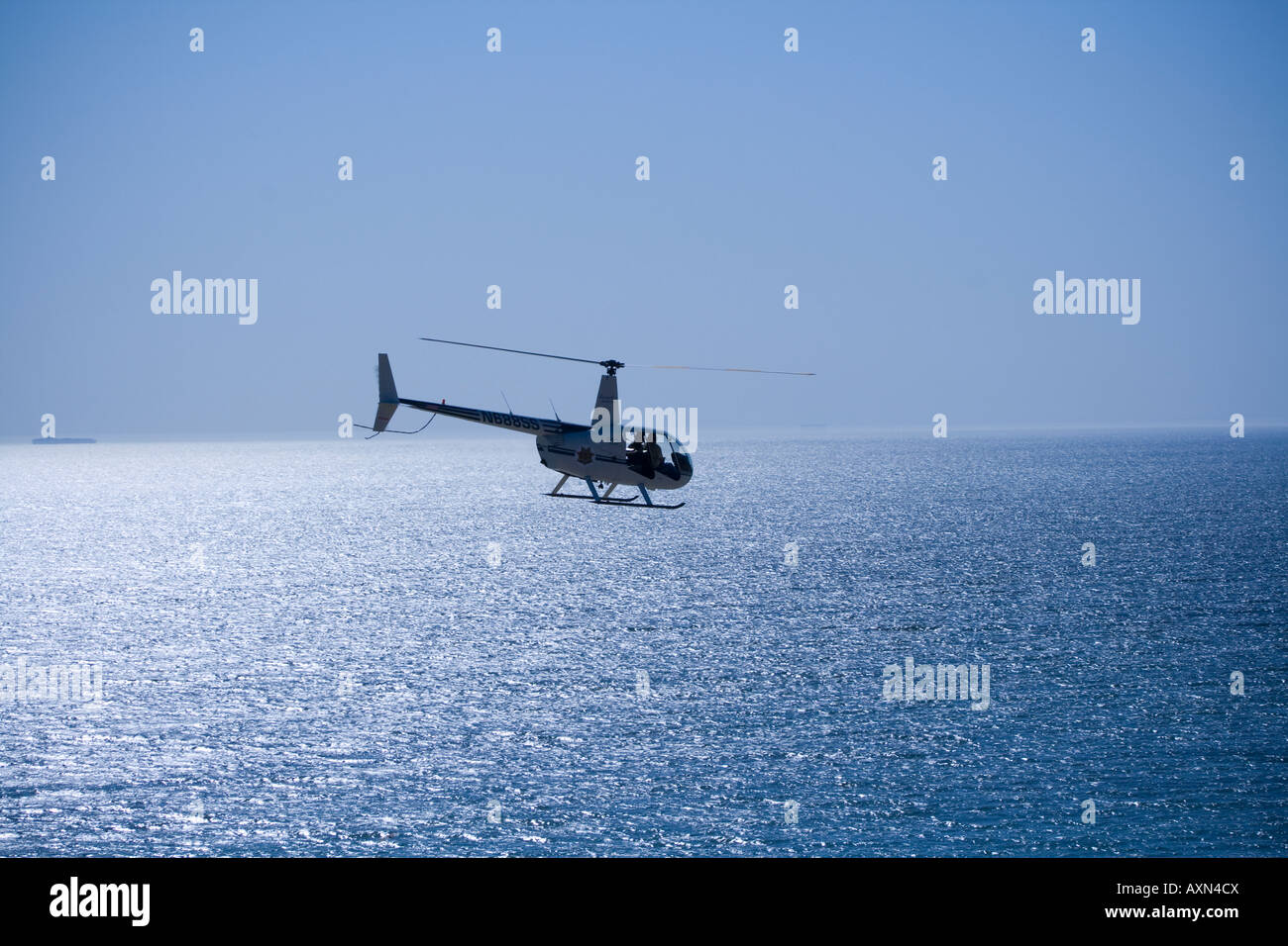 Helicopter over pacific ocean, California Stock Photo - Alamy