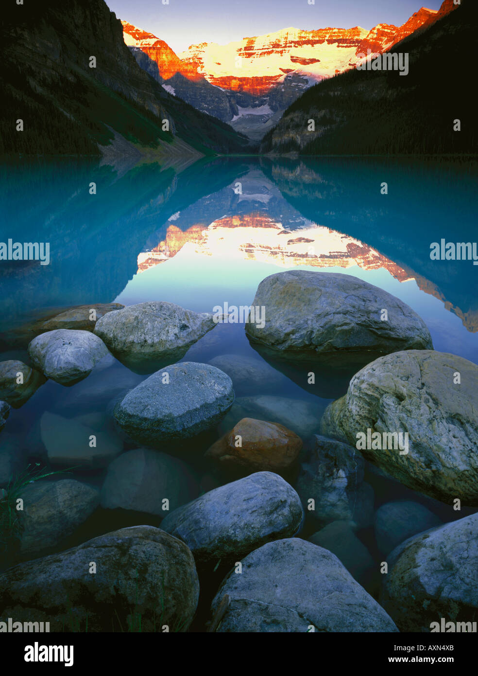 Sunrise lights Mount Victoria and Victoria Glacier with reflections on ...