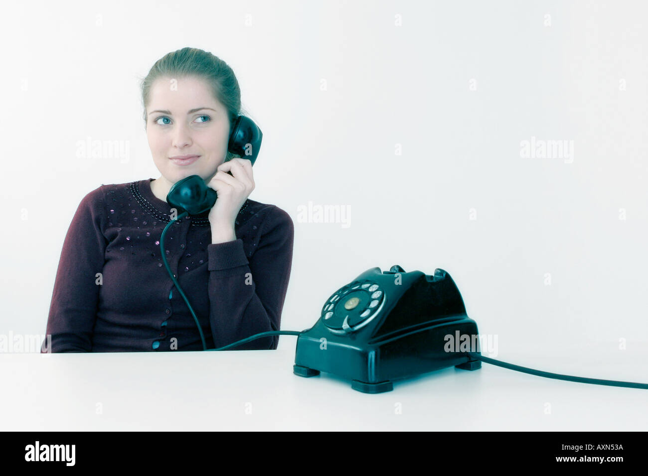 young woman talking on telephone Stock Photo - Alamy