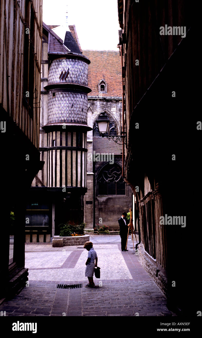 boy in passageway in Dijon Burgundy France behaving like the "Jean qui ...