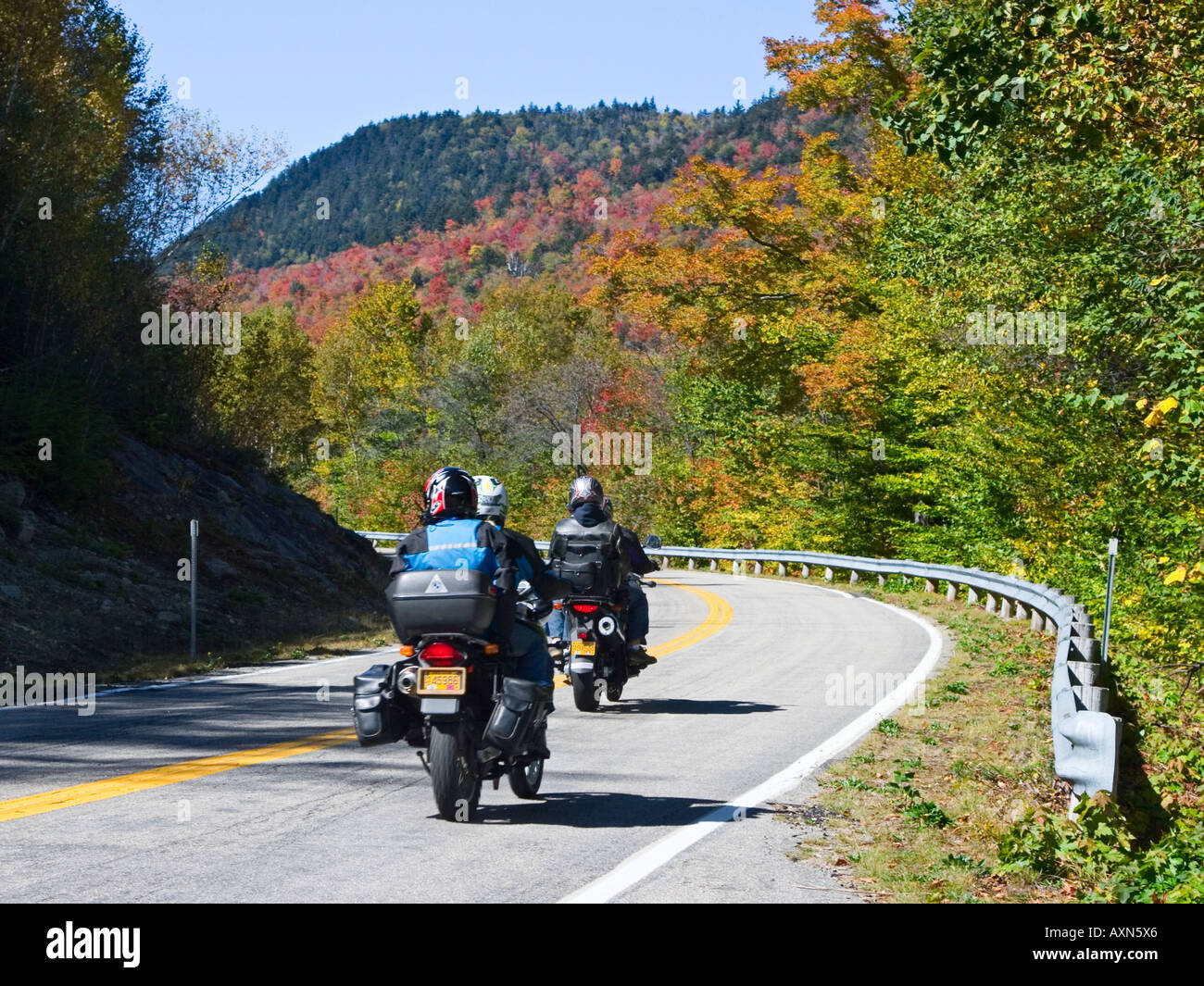 Motorcycles riding along a rural mountain road Stock Photo - Alamy