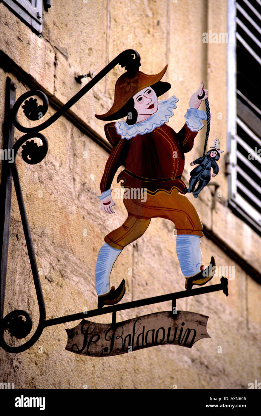 wrought iron painted sign for Baldaquin toy shop in the arcades of ...