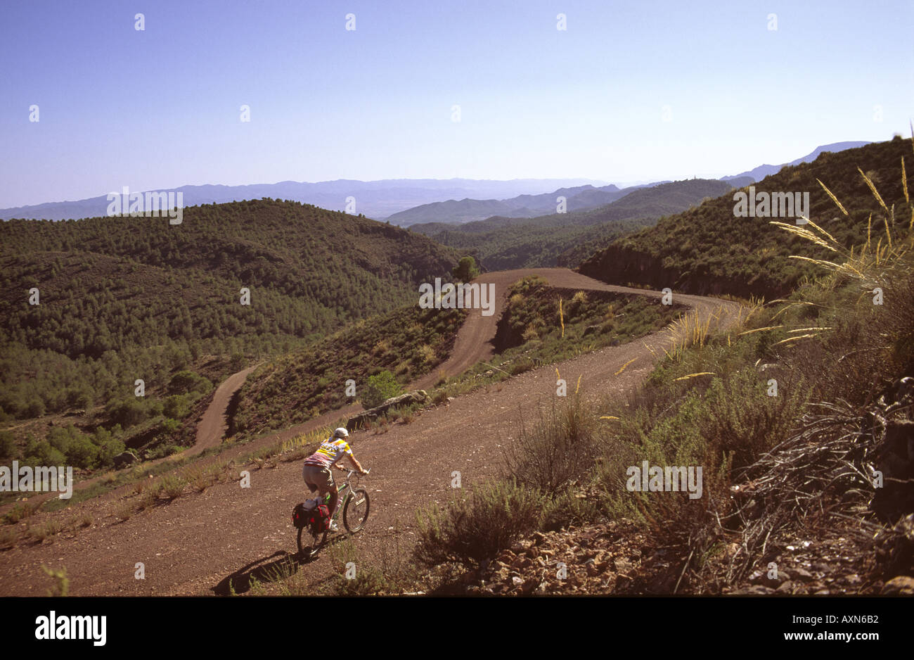 Mountain bike man on switchback trail Stock Photo - Alamy
