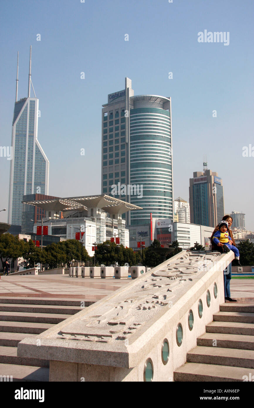 baby sitting on the marble steps leading to The Shanghai Urban Planning ...