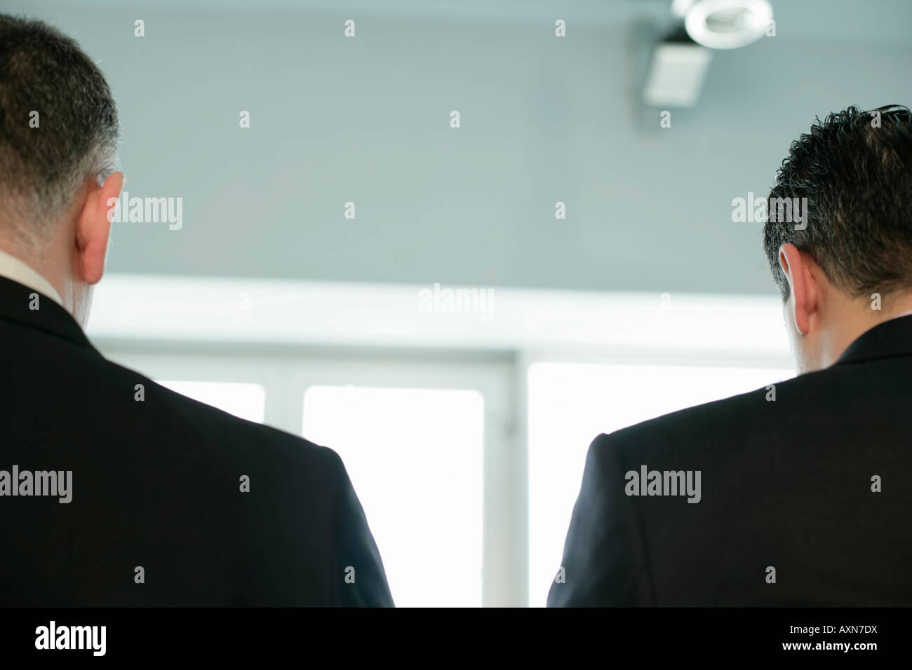 Rear view of two businessmen Stock Photo - Alamy