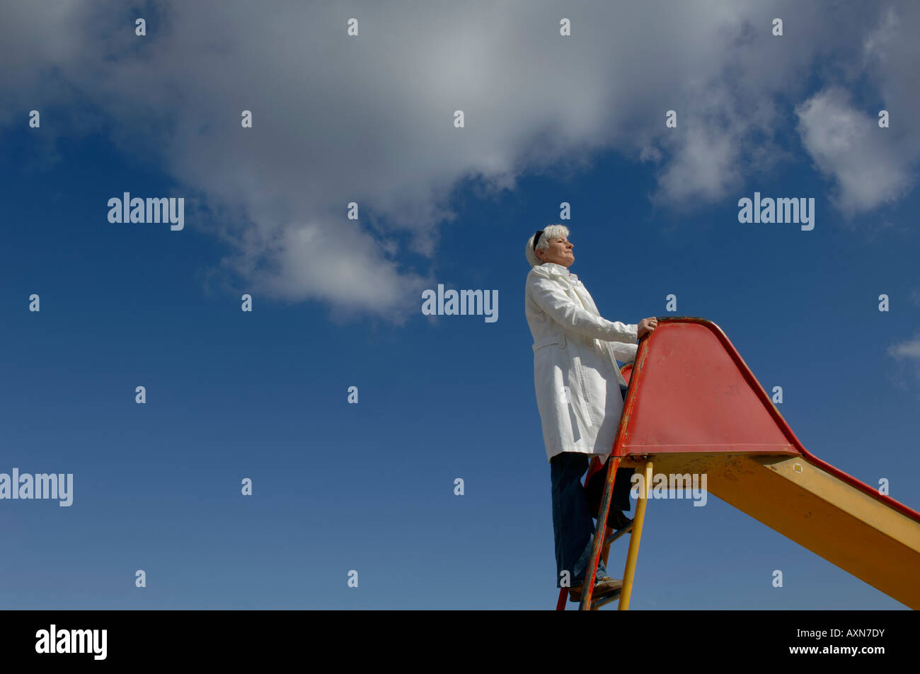 Mature woman at a slide Stock Photo - Alamy