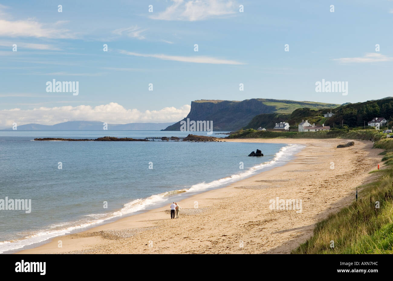 Young couple walking on Ballycastle Beach, County Antrim, Northern ...