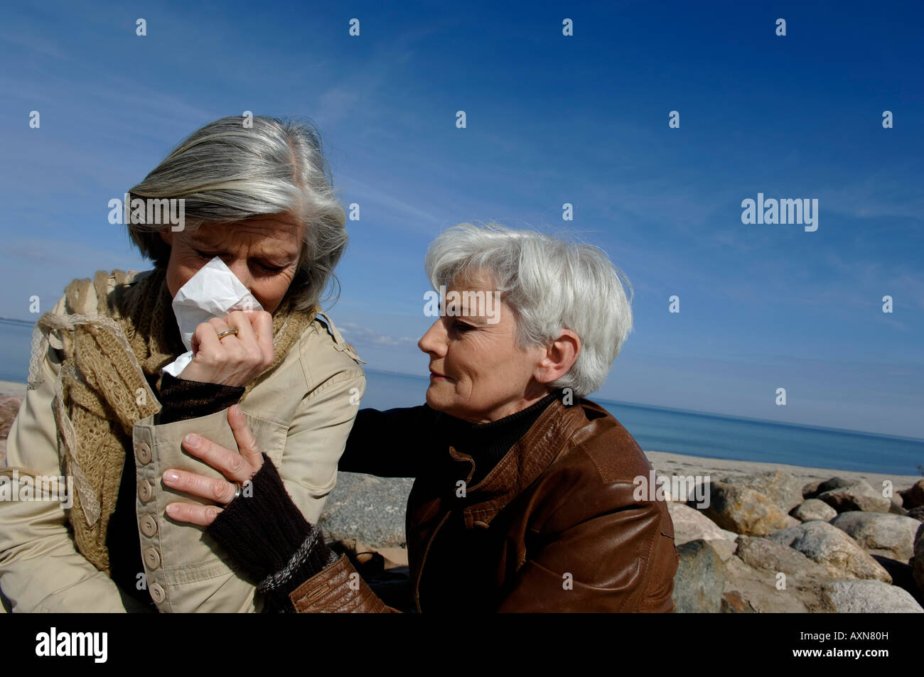 Mature woman consoling a friend Stock Photo - Alamy