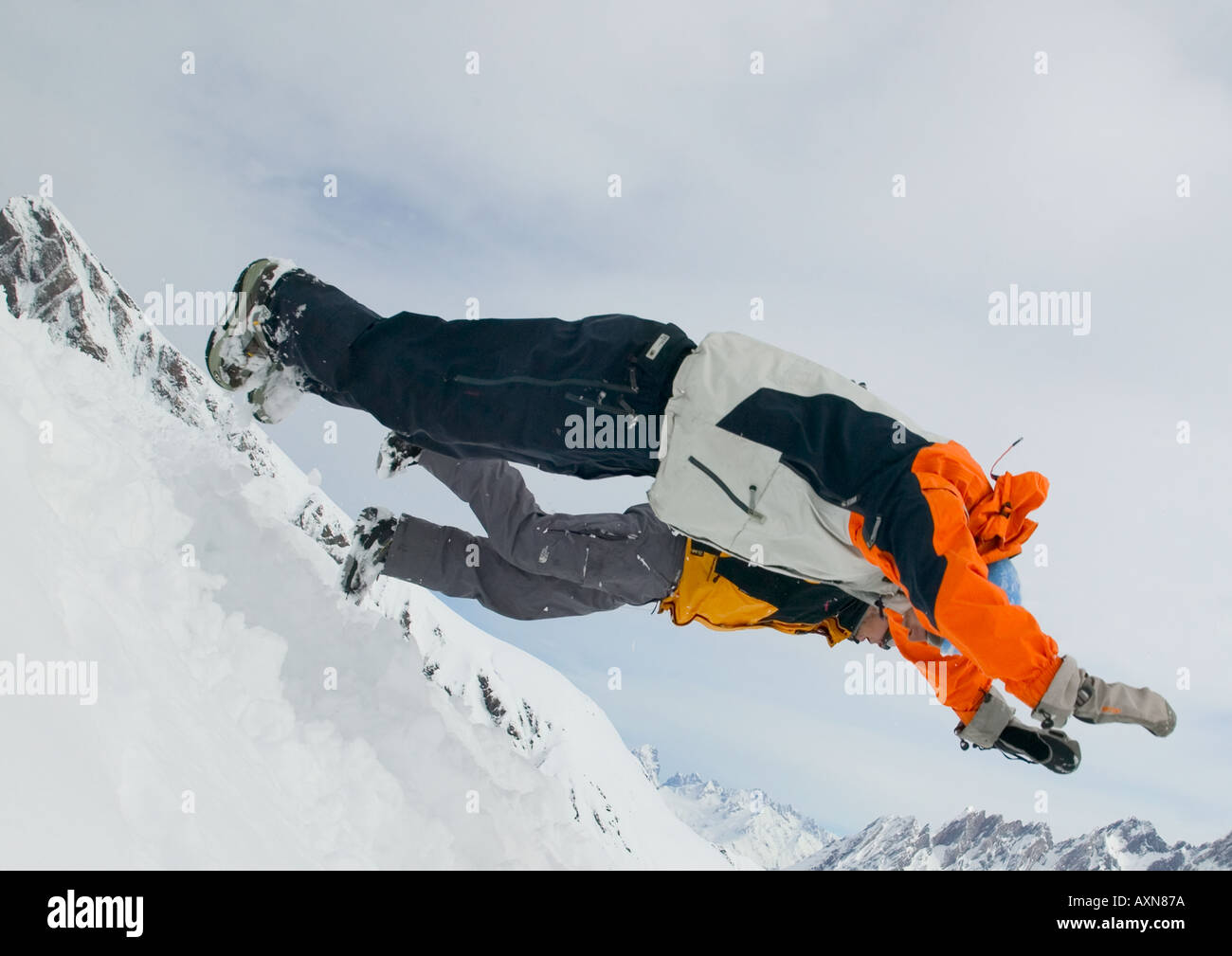 two males diving and jumping in snow Stock Photo - Alamy