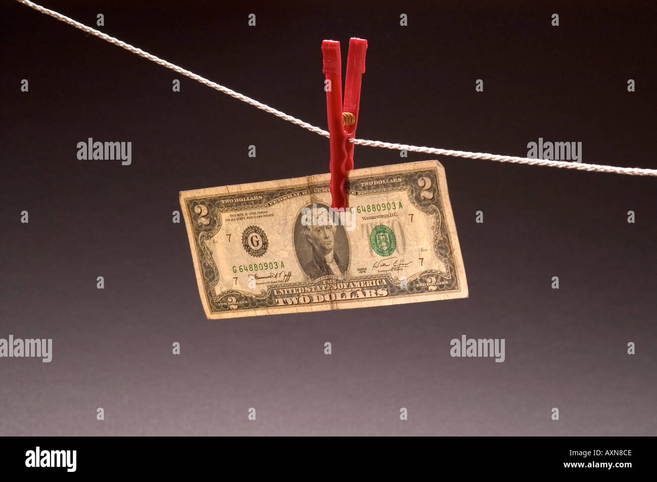 Washed money hanged on a rope currency pegs dollars note dirty money ...