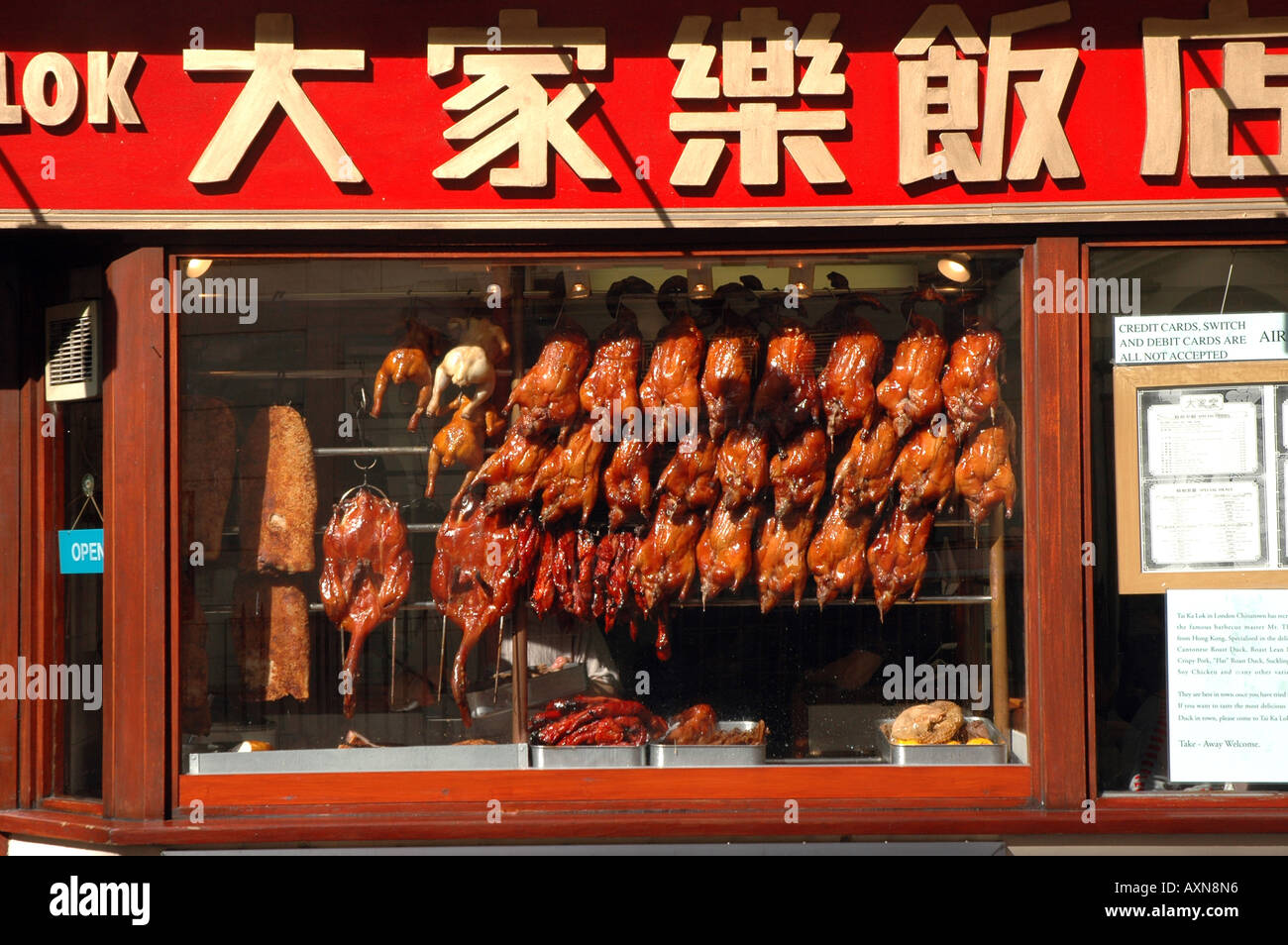 Roasted ducks hanging in window hi-res stock photography and images - Alamy