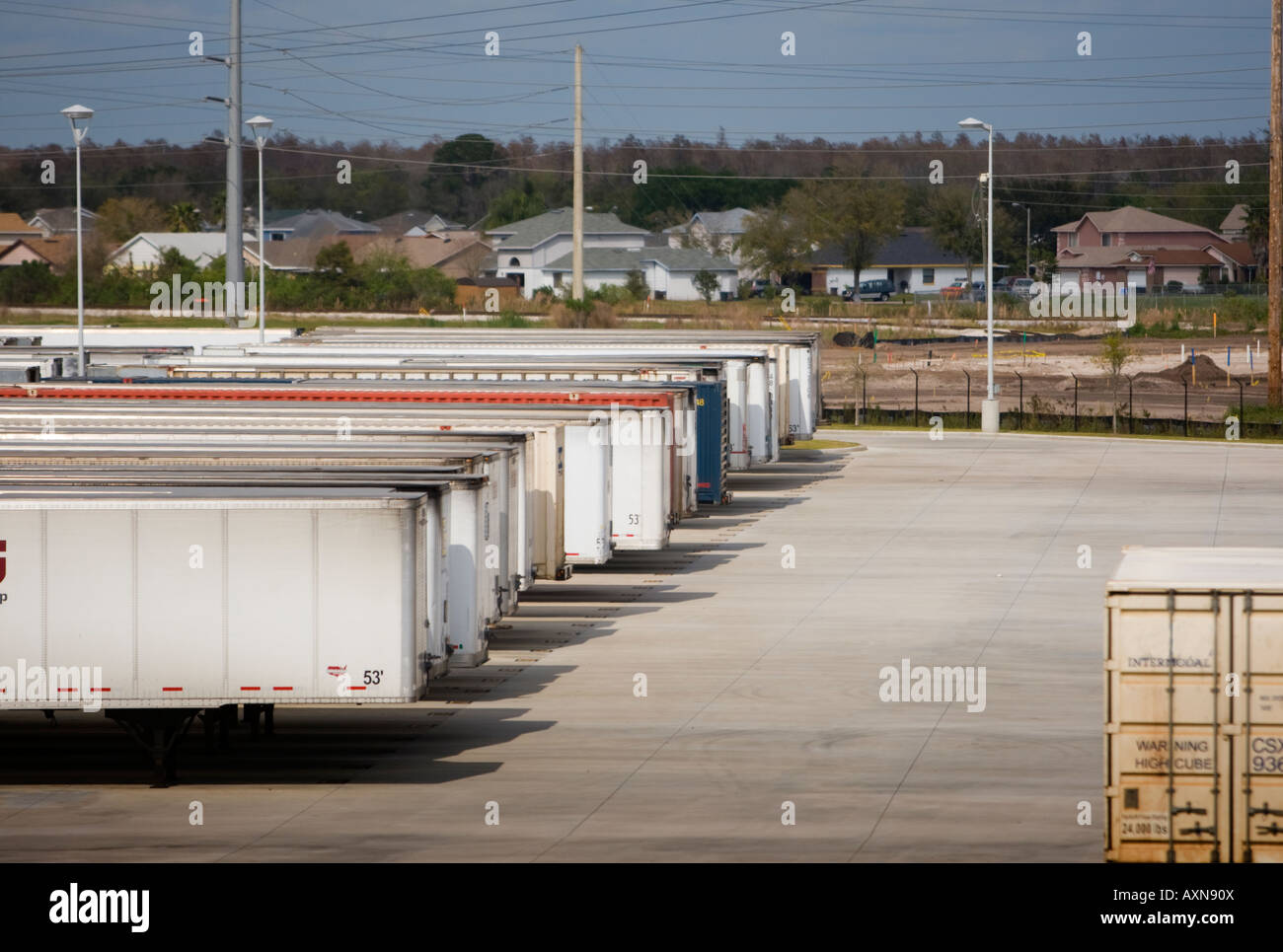 Trailers at a warehouse Stock Photo - Alamy